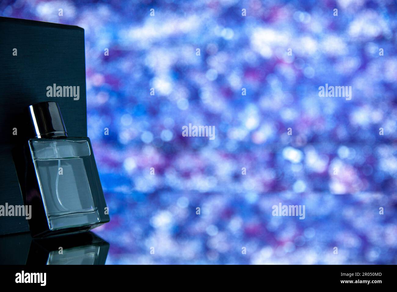 front view expensive perfume on a purple background scent fragnance ...