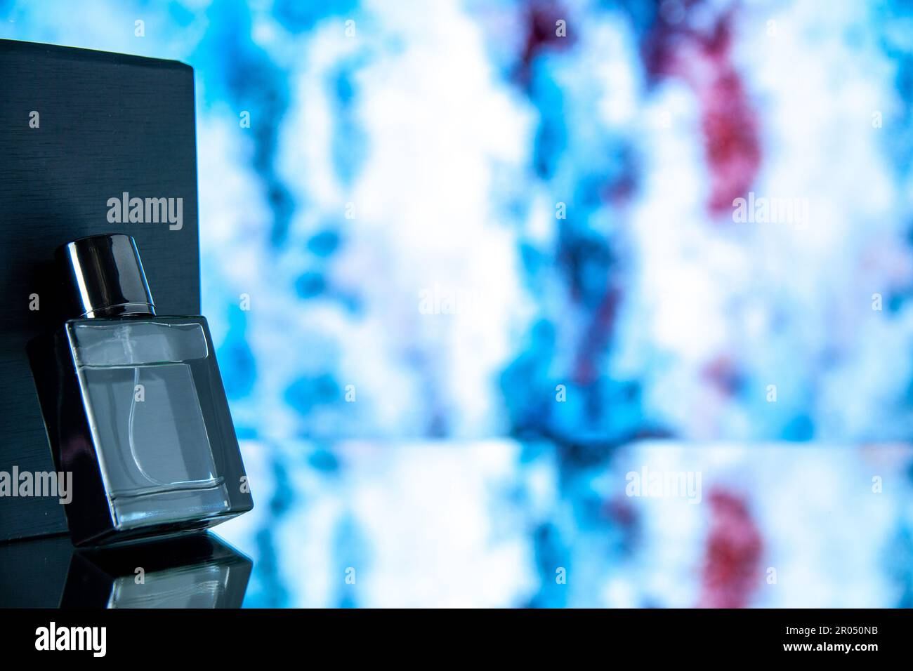 front view expensive perfume on a light blue background fragnance ...