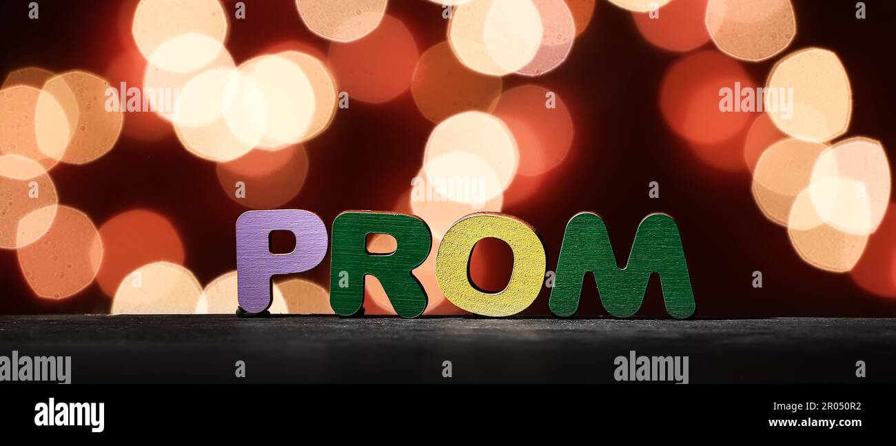 Word PROM on dark background with blurred lights Stock Photo - Alamy