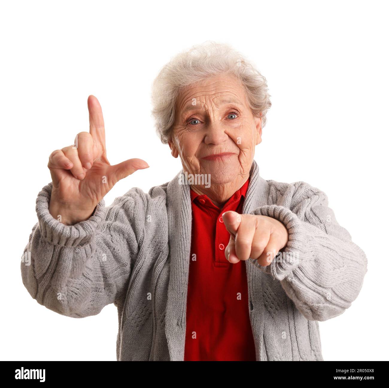 Senior woman showing loser gesture on white background Stock Photo - Alamy