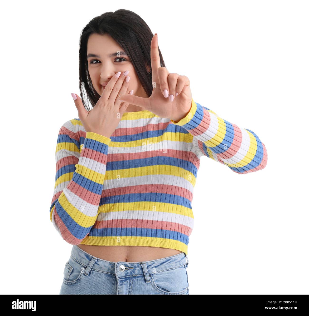 Young woman showing loser gesture on white background Stock Photo - Alamy