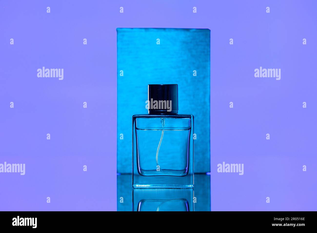 front view expensive perfume on purple background scent fragnance ...