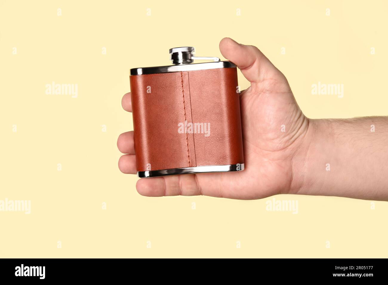 Male hand holding hip flask hi-res stock photography and images - Alamy
