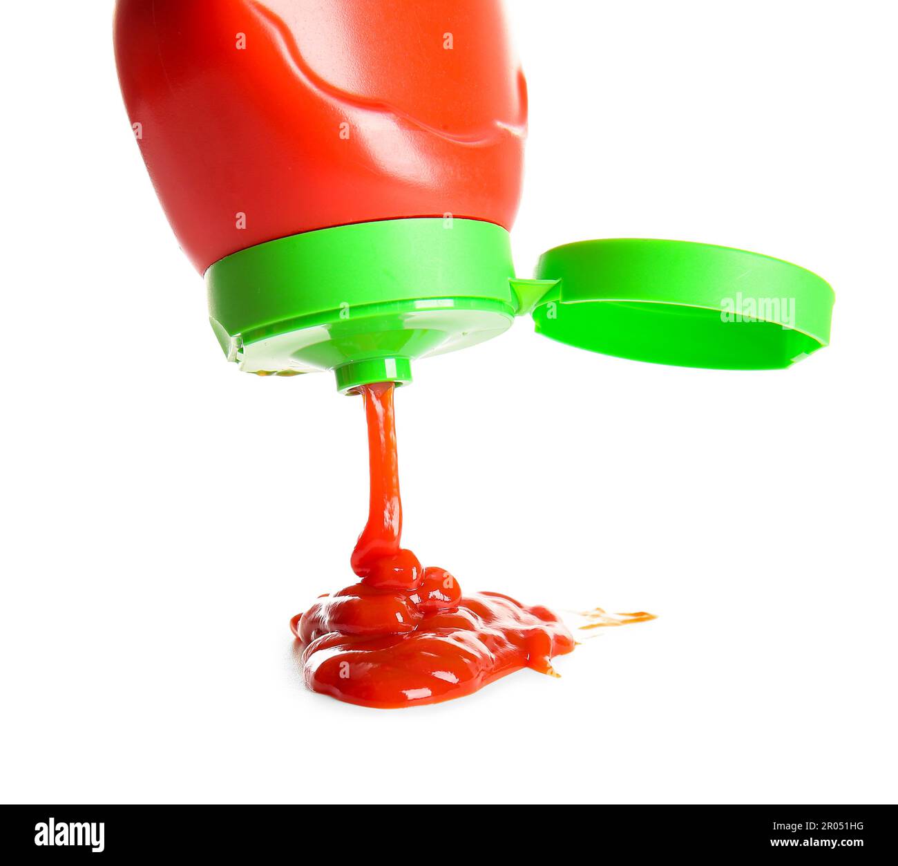 Ketchup squeezed out of bottle on white background Stock Photo - Alamy