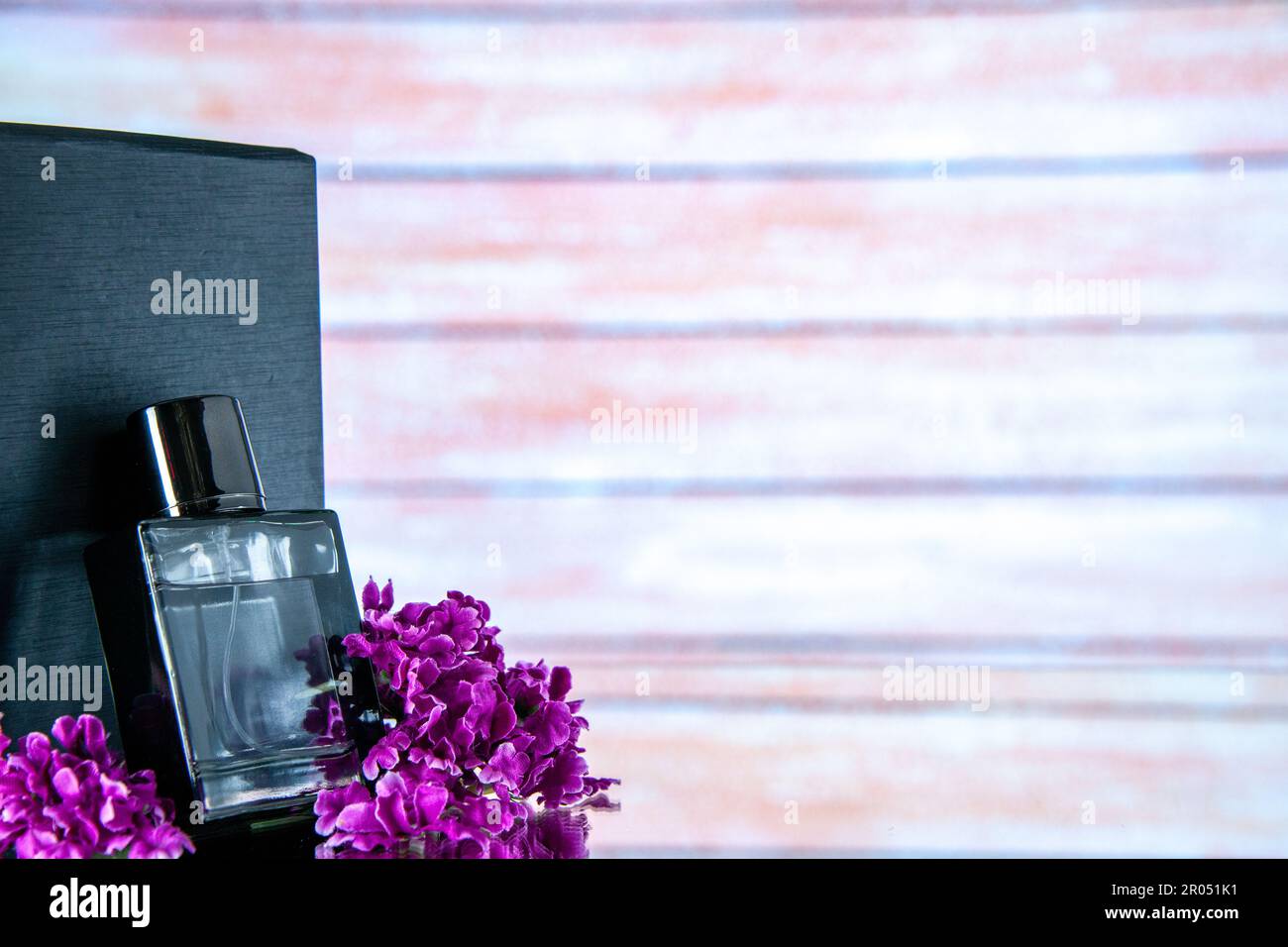 front view expensive perfume with flowers on light background fragnance ...