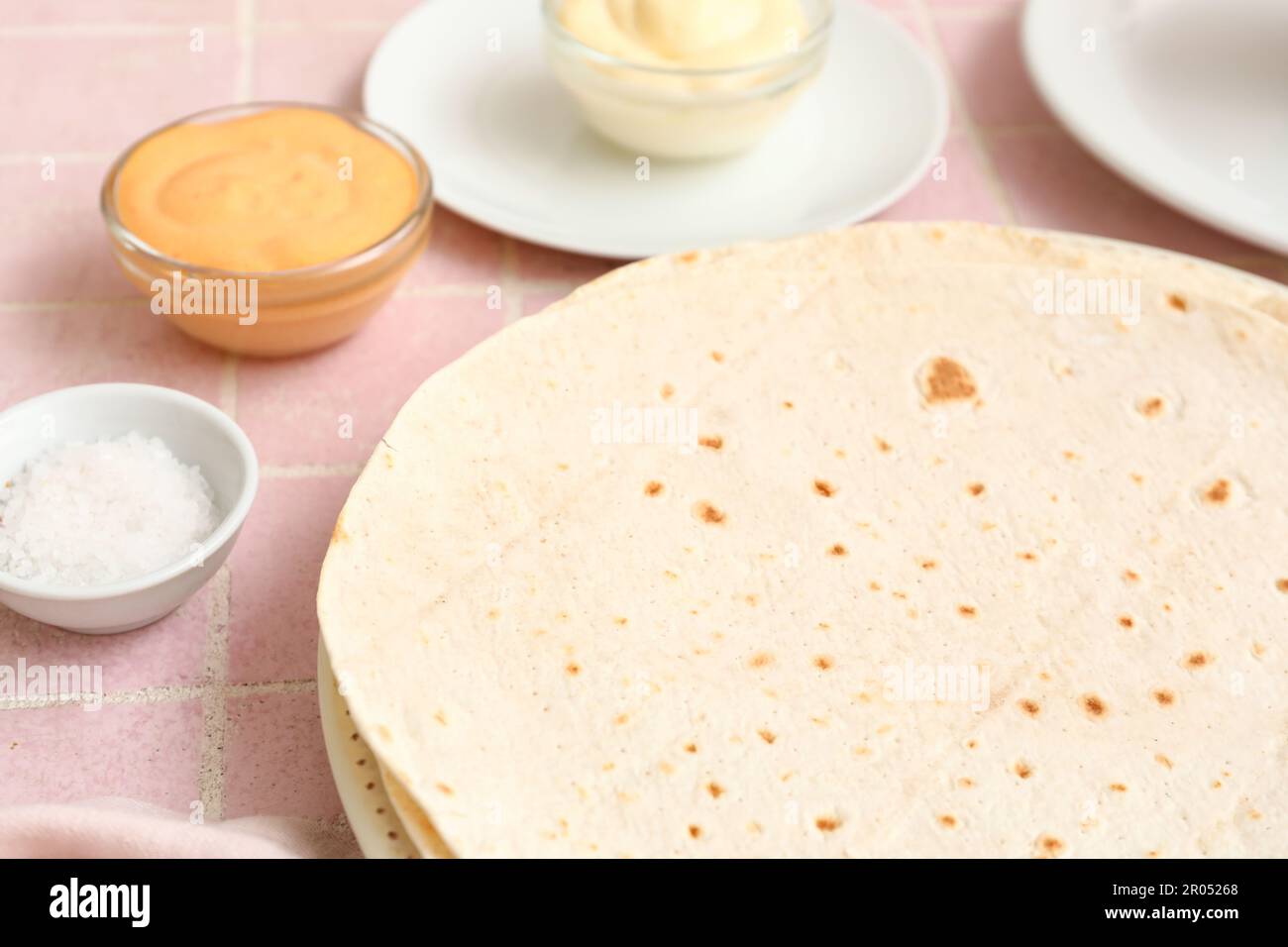 Plate with fresh lavash on pink tile background, closeup Stock Photo ...