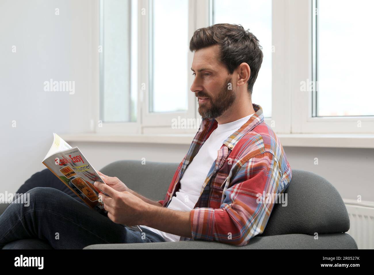 Bearded man reading hi-res stock photography and images - Alamy