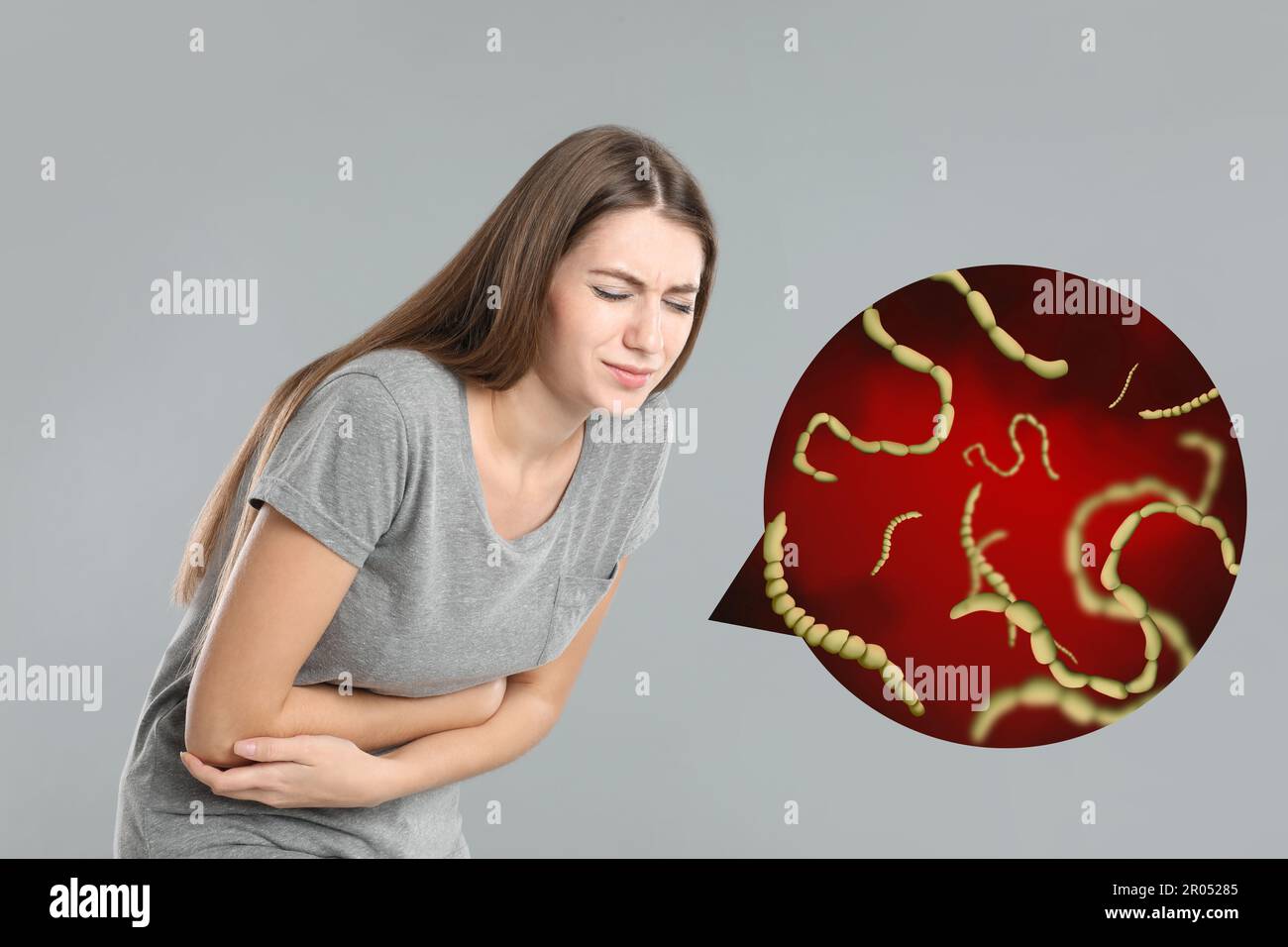 Parasites under microscope and woman suffering from helminthiasis Stock ...