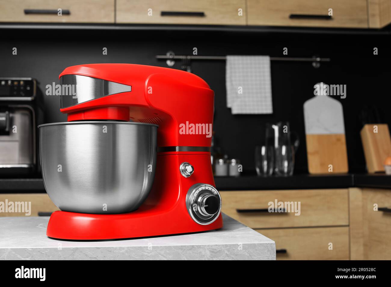 Modern stand mixer on table in kitchen, space for text. Home appliance ...