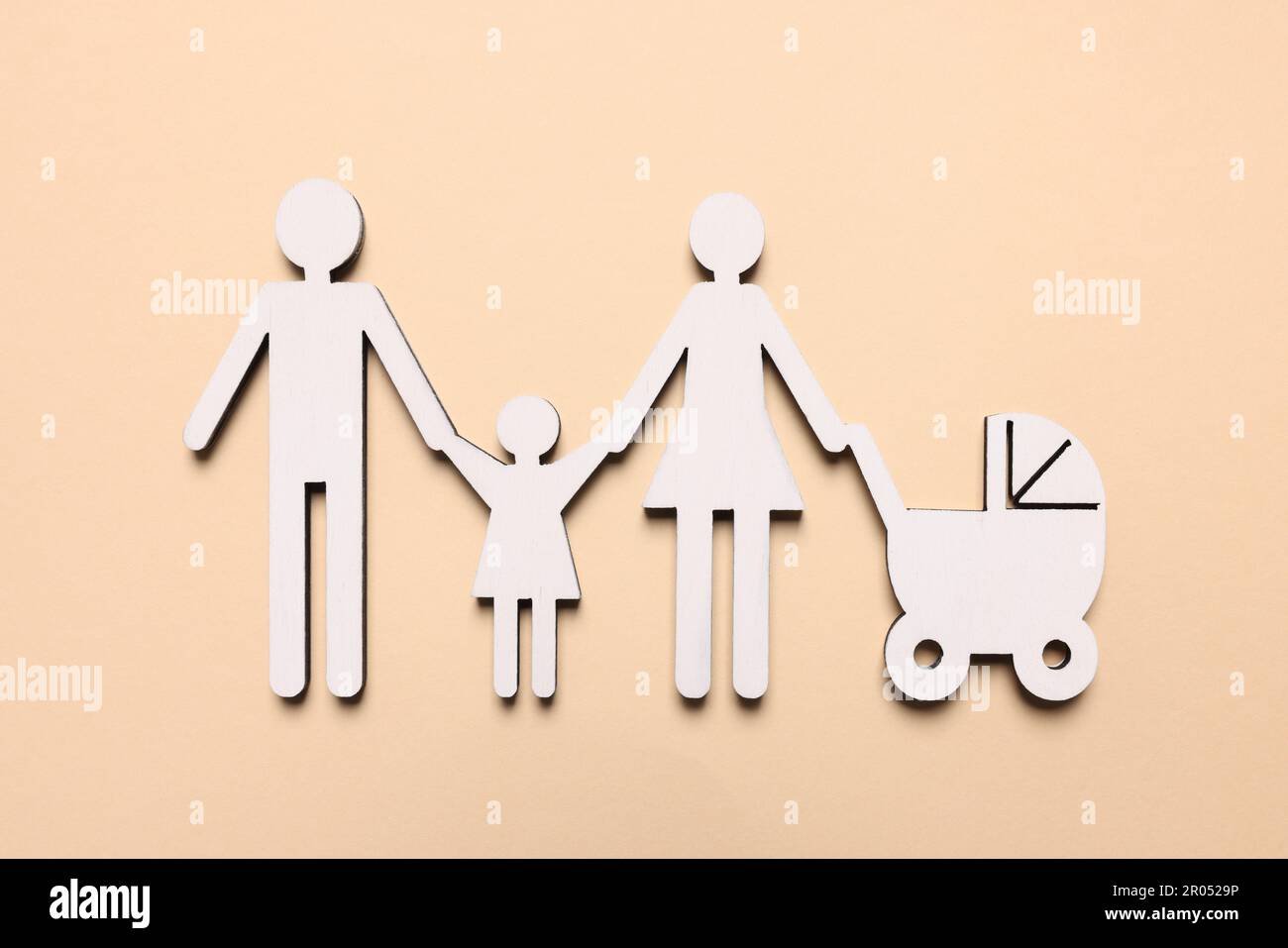 Figures of family on beige background, top view. Insurance concept ...