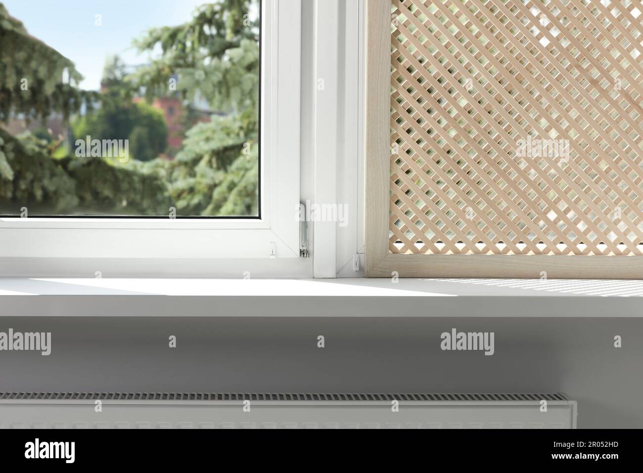 Empty white window sill and decorative wooden shutter indoors Stock ...