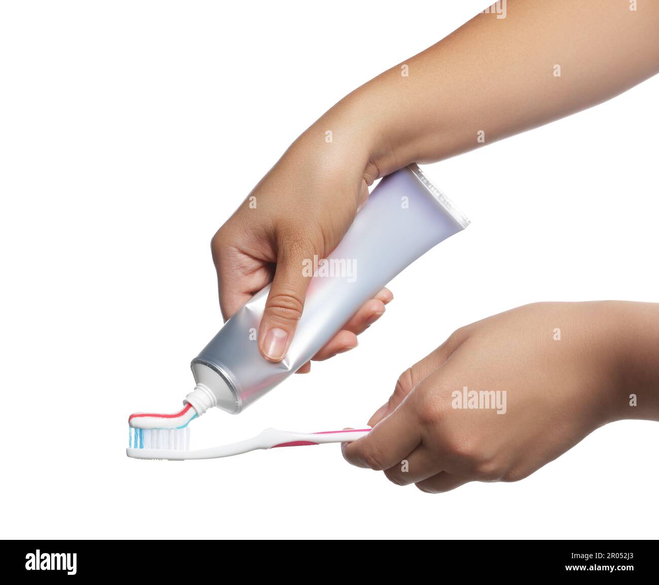 Woman Applying Toothpaste On Brush Against White Background Closeup
