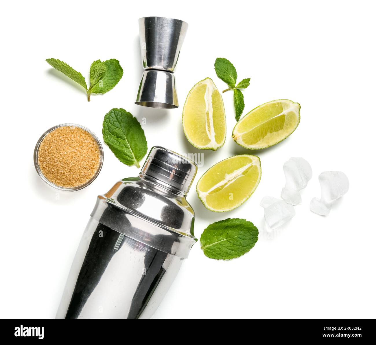 Shaker, measure cup and ingredients for preparing mojito on white background Stock Photo - Alamy