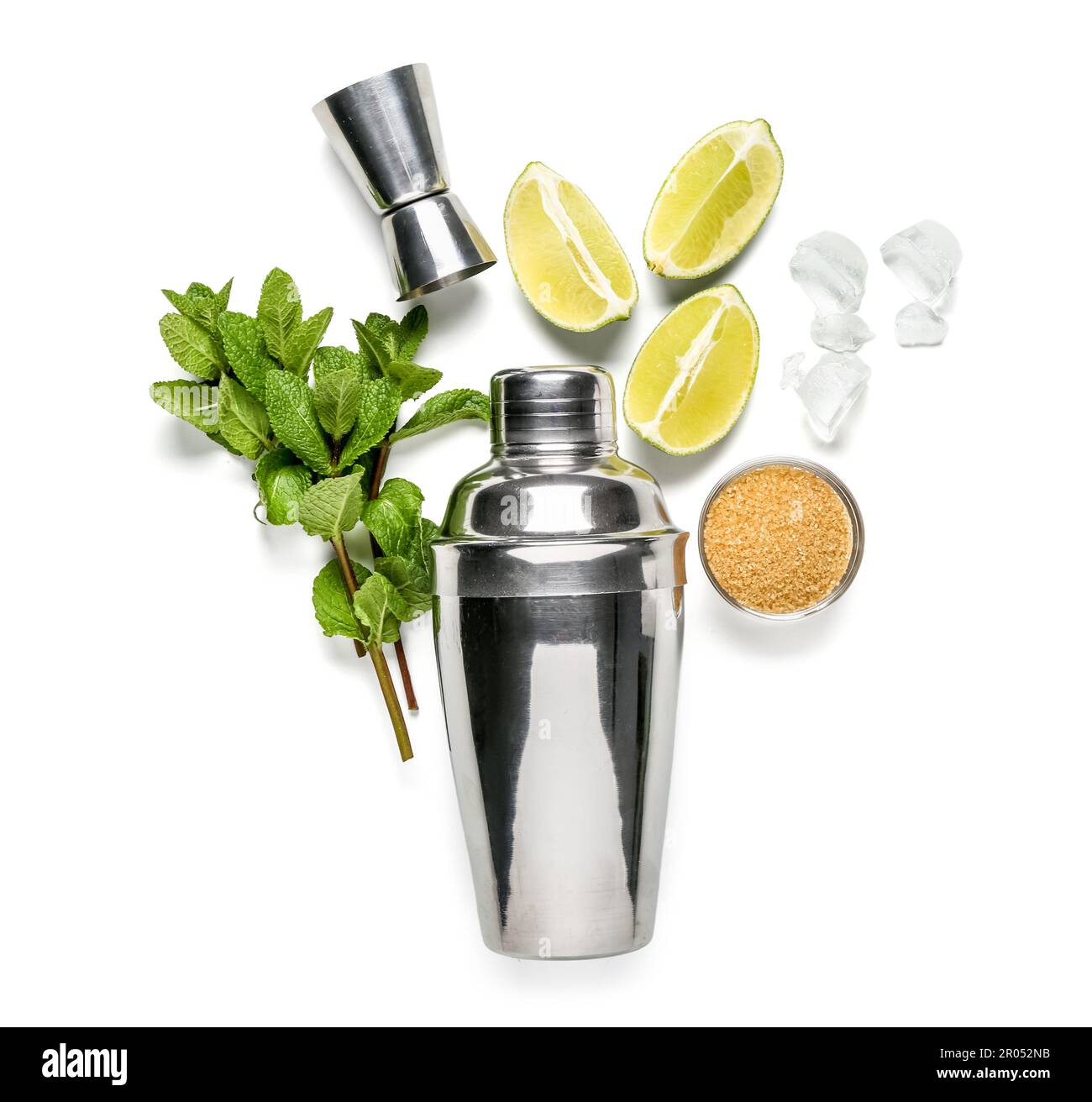 Shaker, measure cup and ingredients for preparing mojito on white ...