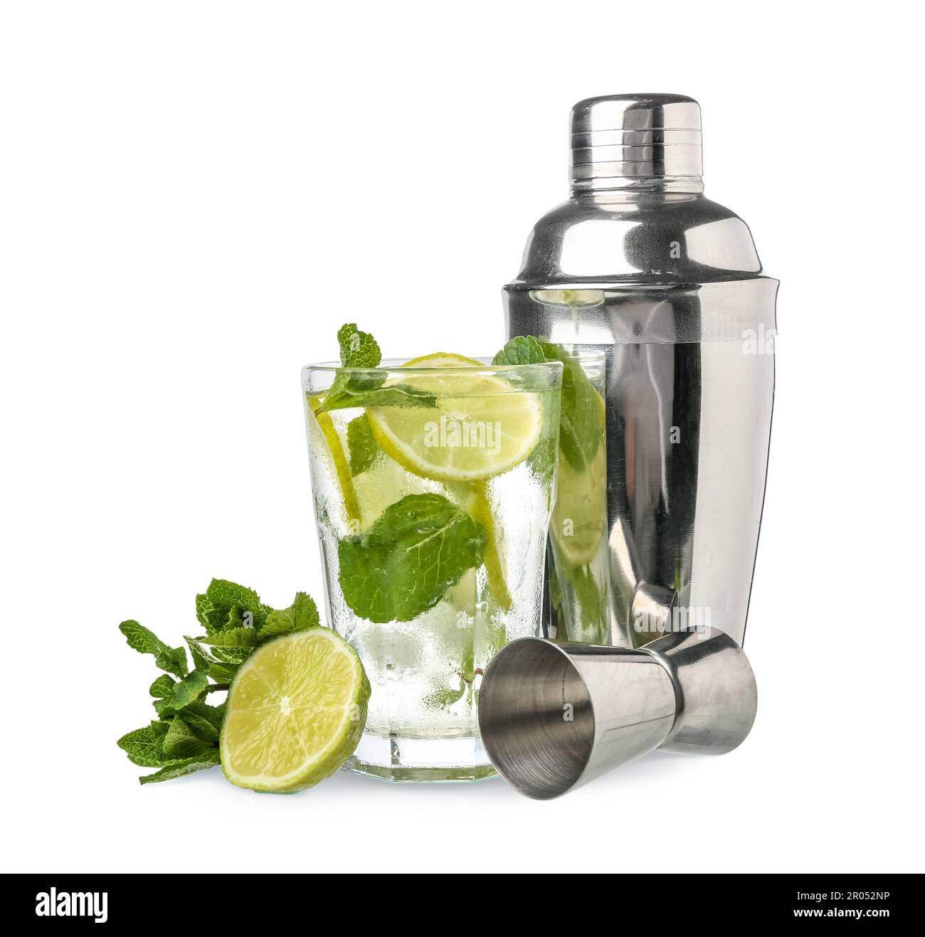 Shaker, measure cup and glass of tasty mojito on white background Stock ...