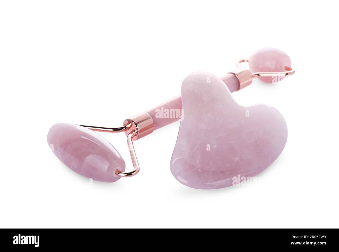 Rose quartz gua sha tool and facial roller isolated on white Stock ...