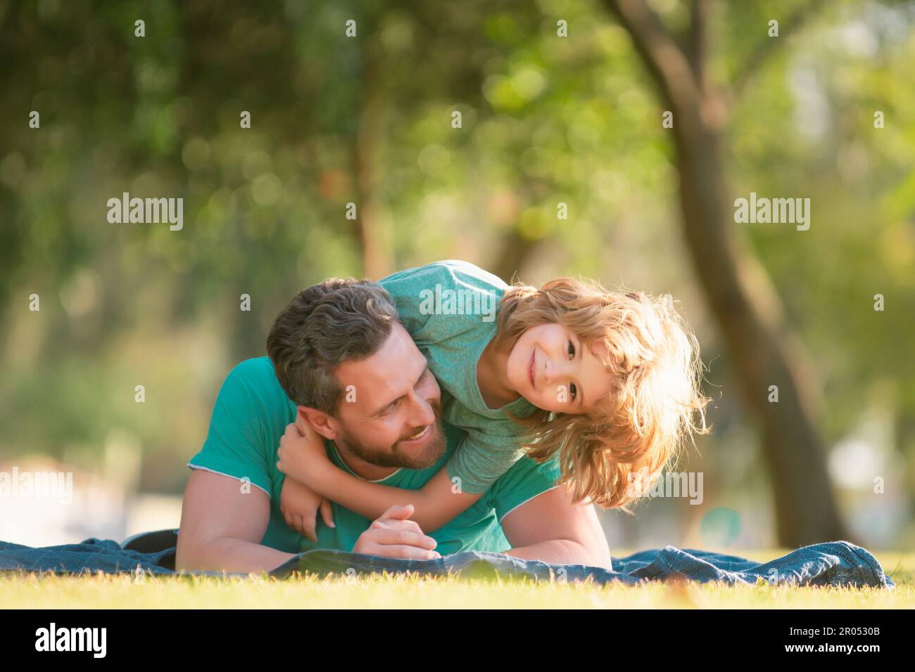 Childhood and parenthood kids concept. Happy father and son playing ...