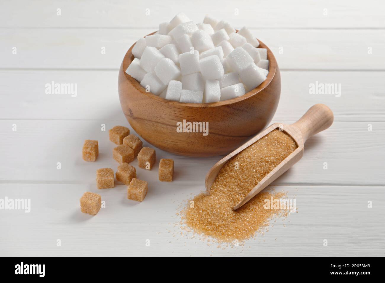 Different types of sugar on white wooden table Stock Photo - Alamy