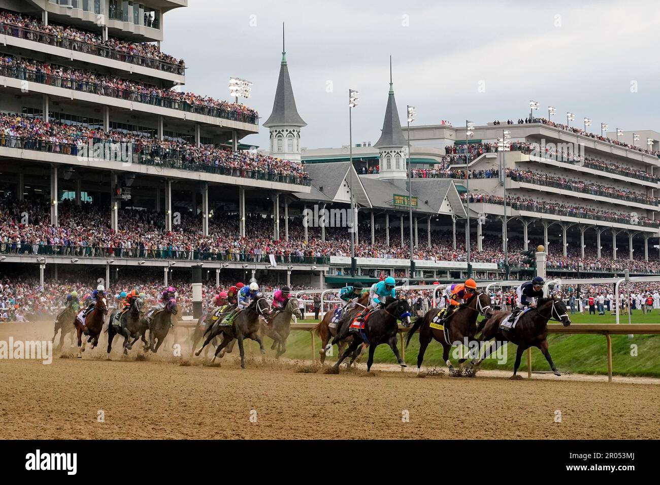 Horses come through the first turn during the 149th running of the ...