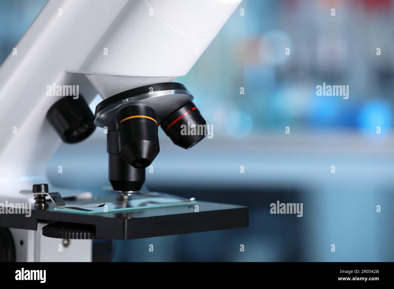 Modern medical microscope against blurred background, closeup. Space ...