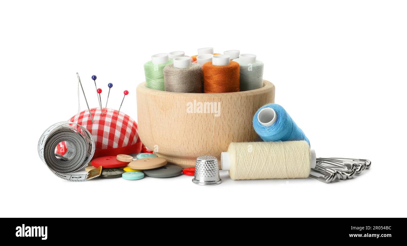 Spools of threads and sewing tools on white background Stock Photo - Alamy