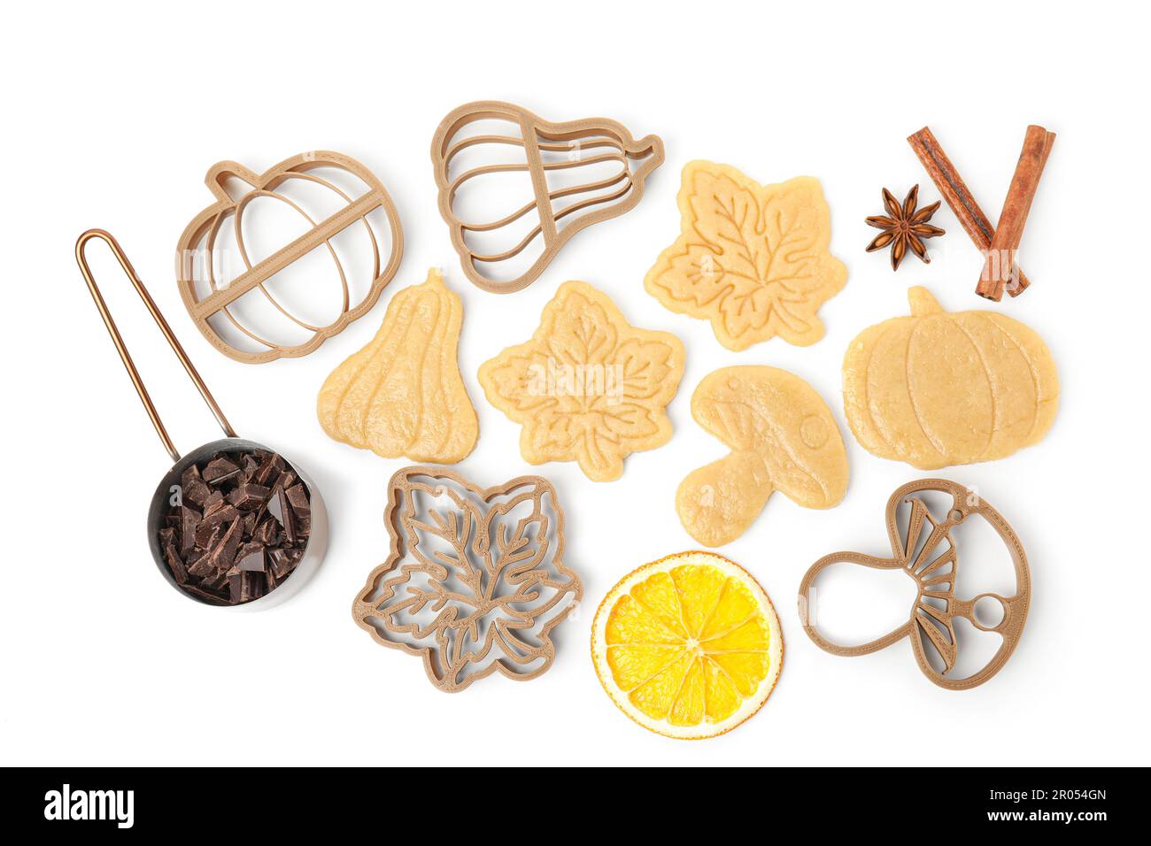 Flat lay composition with cookie cutters and unbaked biscuits on white ...