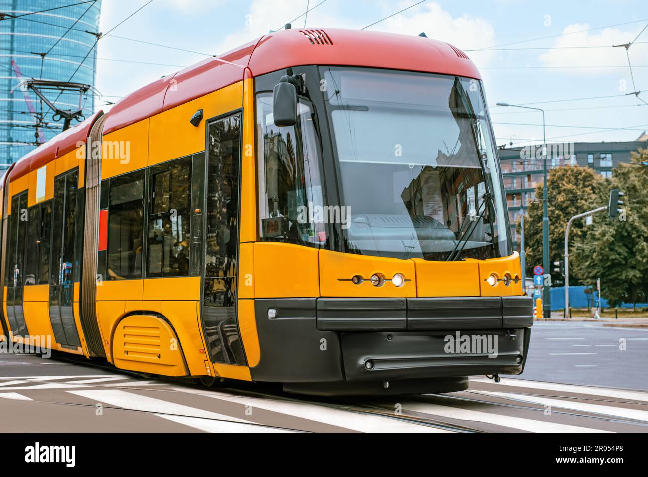 Modern tram on city street. Public transport Stock Photo - Alamy