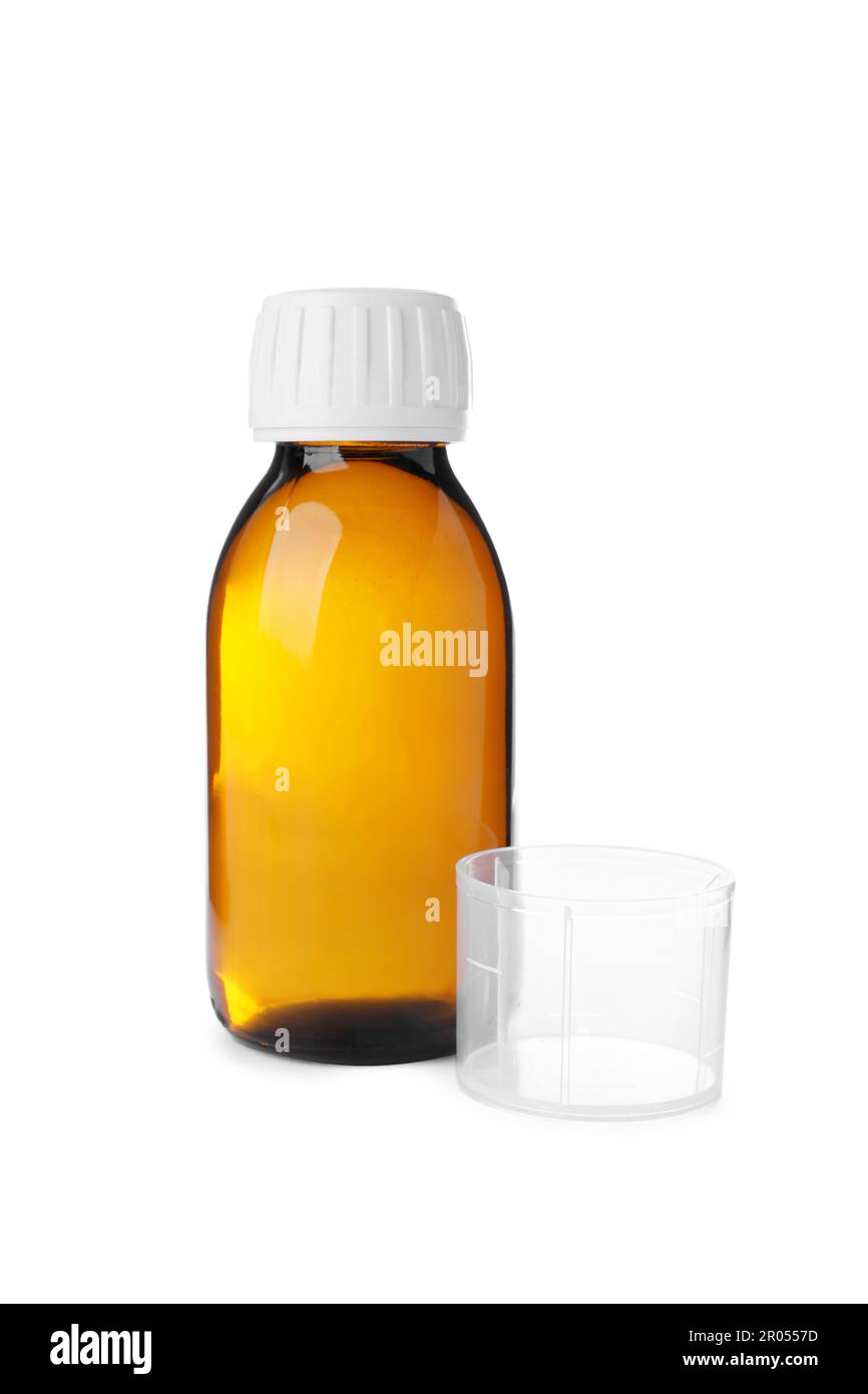 Bottle of syrup with measuring cup on white background. Cough and cold ...