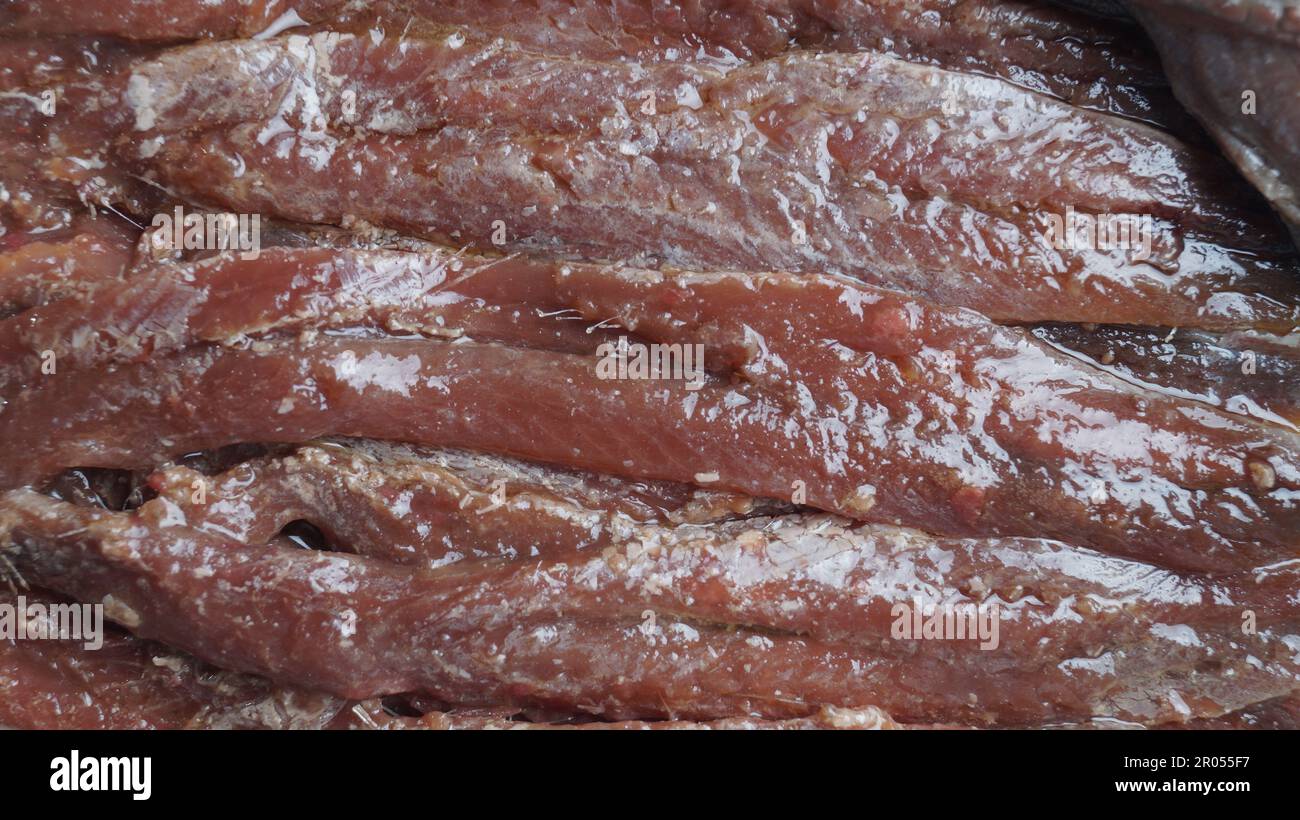 Canned anchovy fillets as background, closeup view Stock Photo - Alamy