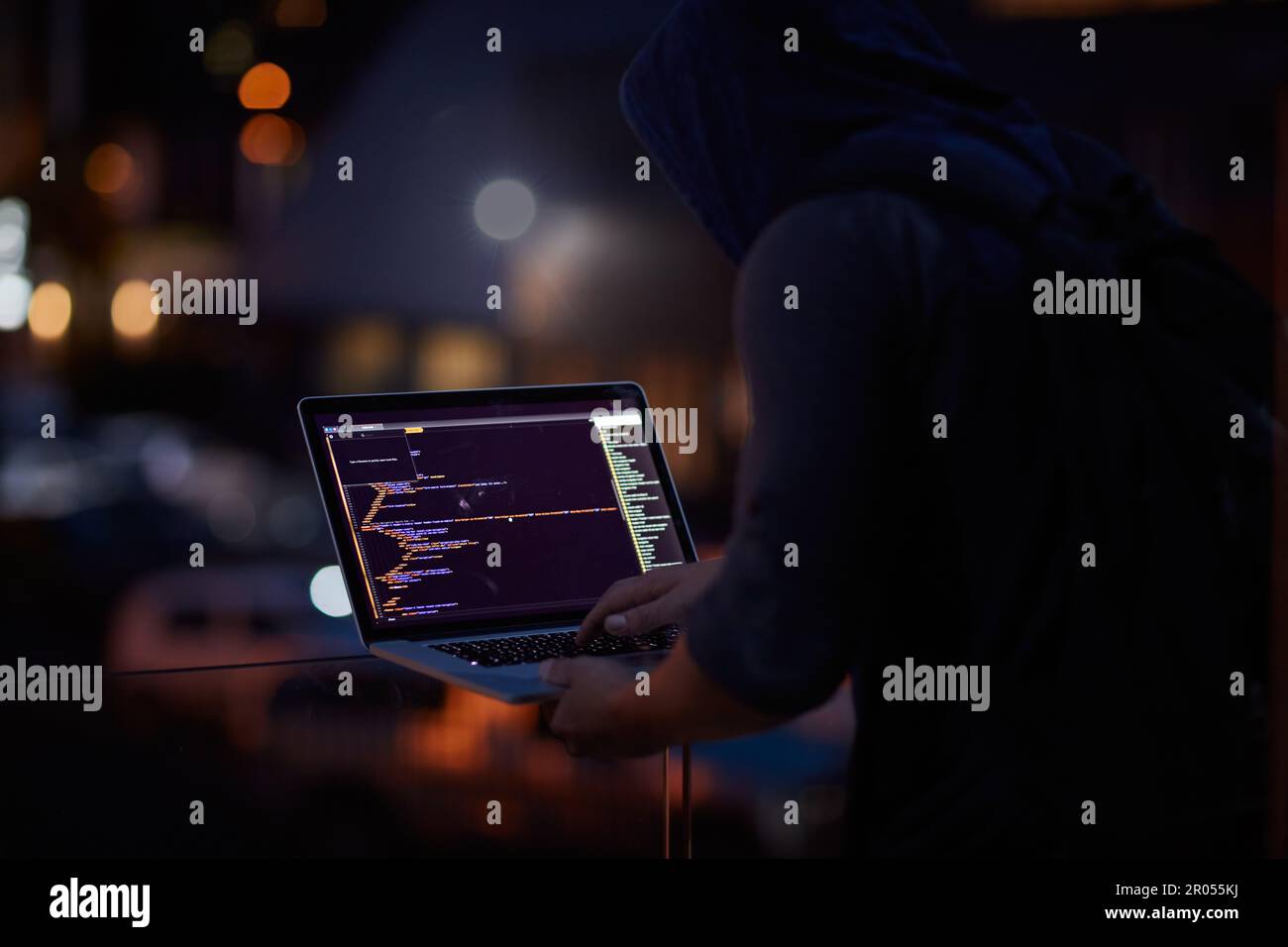 Is your data in safe hands. an unrecognisable hacker using a laptop in ...