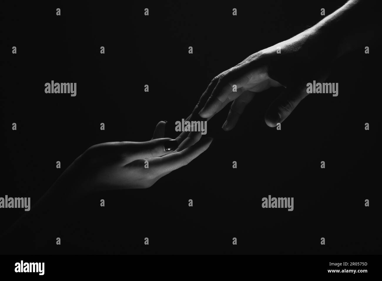 Two hands at the moment of farewell. Romantic touch with fingers, love ...