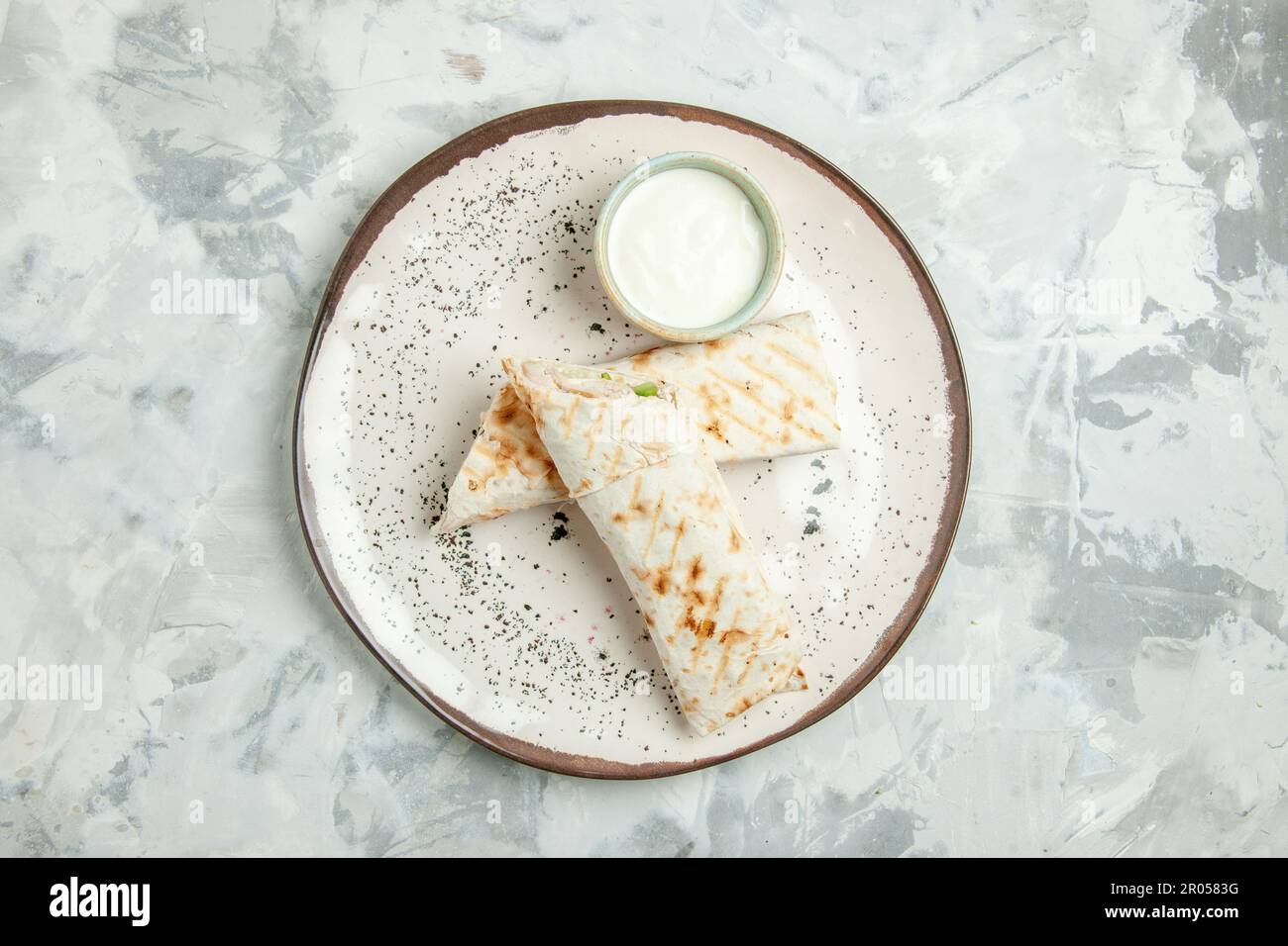 top view delicious shawarma sliced pita sandwich with meat on white ...