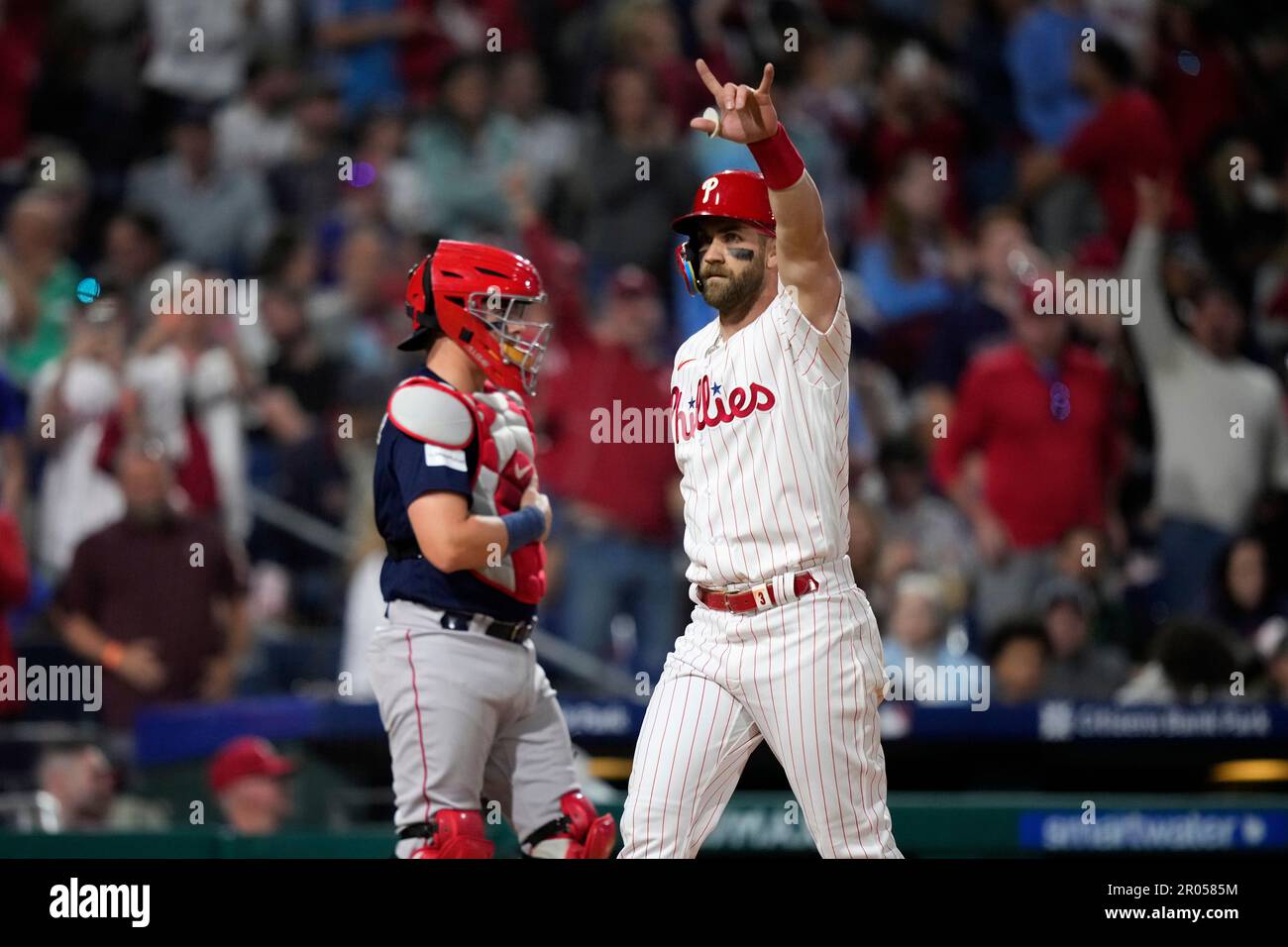 Philadelphia Phillies' Bryce Harper, right, reacts after hitting a home ...
