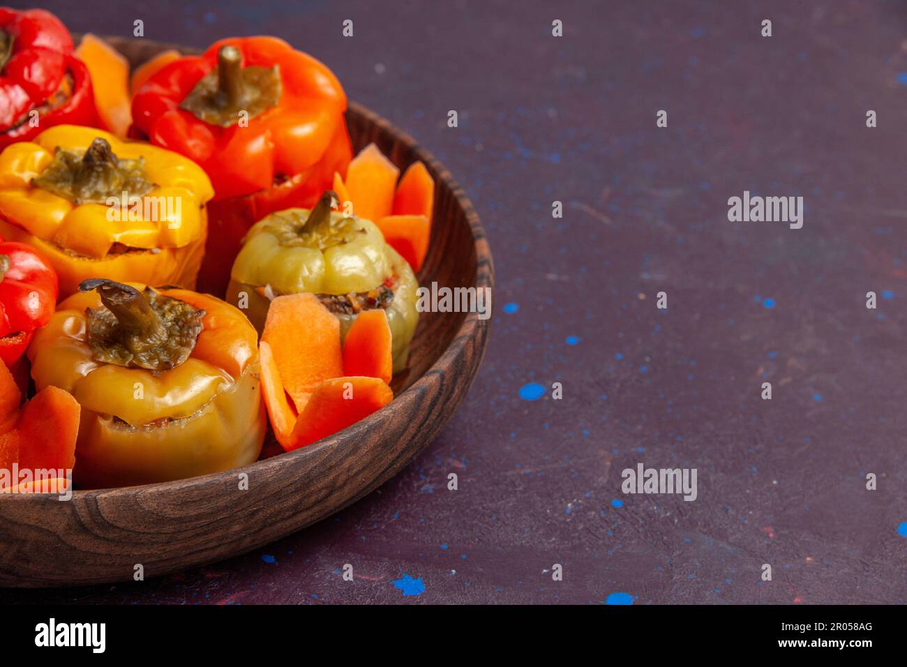 front close view cooked bell-peppers with ground meat on grey ...