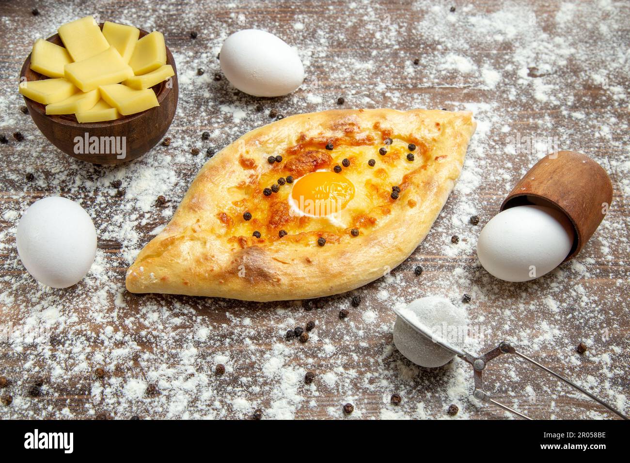 front view baked egg bread with flour on brown background dough egg ...