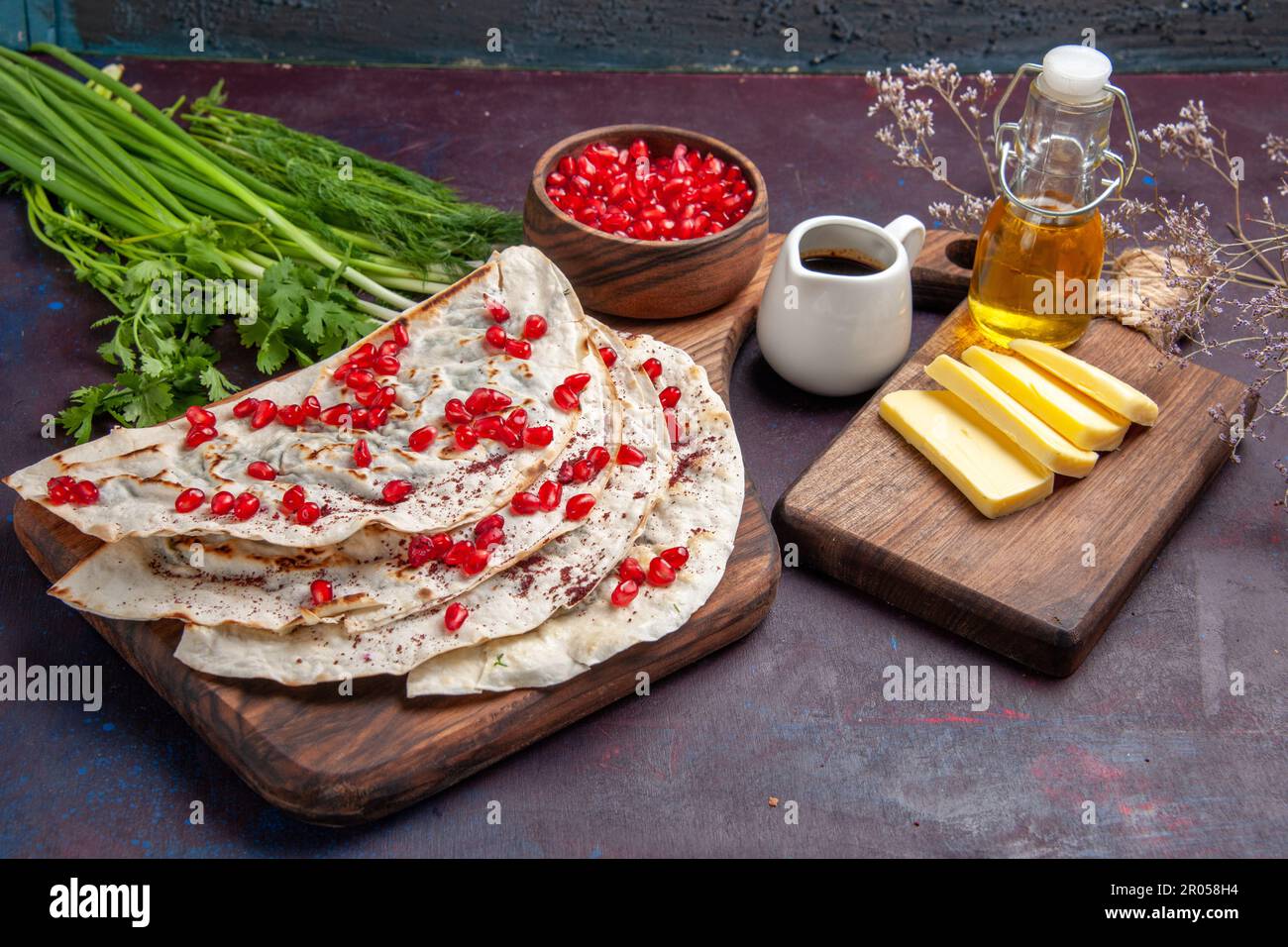 front view delicious meat qutabs pitas with fresh red pomegranates on ...