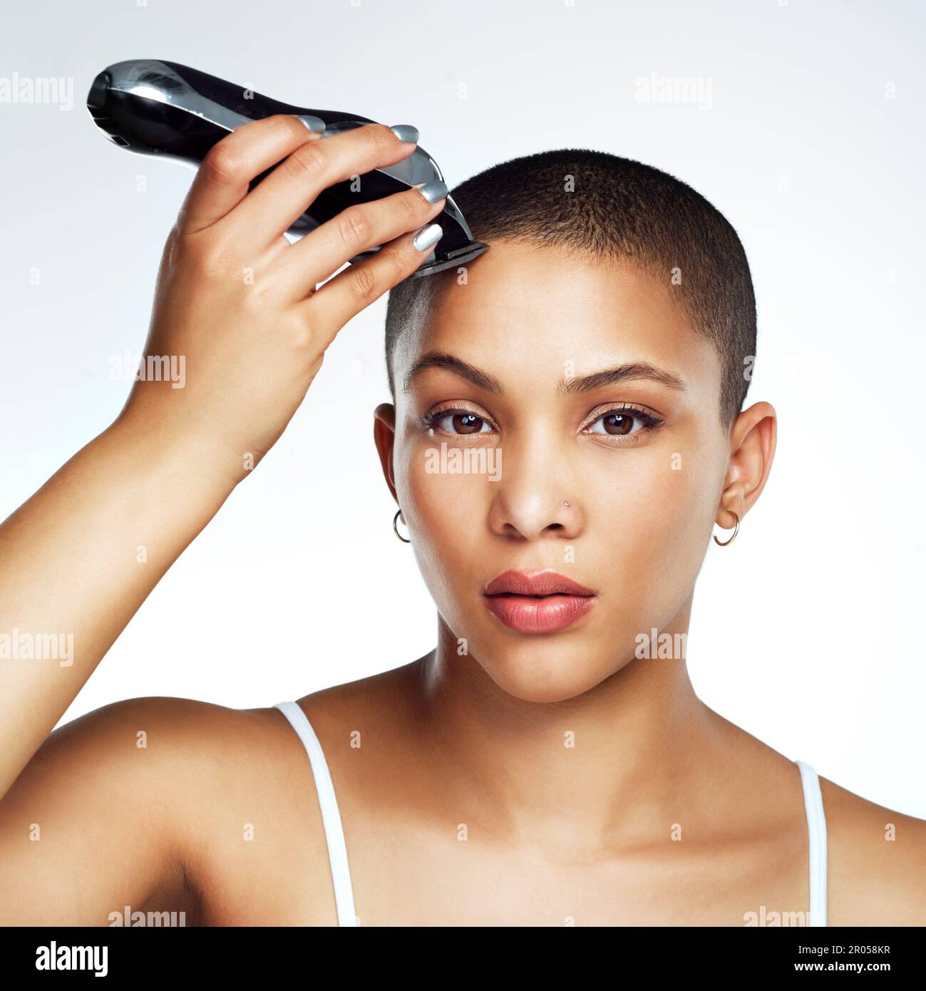 Be whatever you want. Studio shot of a beautiful young woman shaving ...