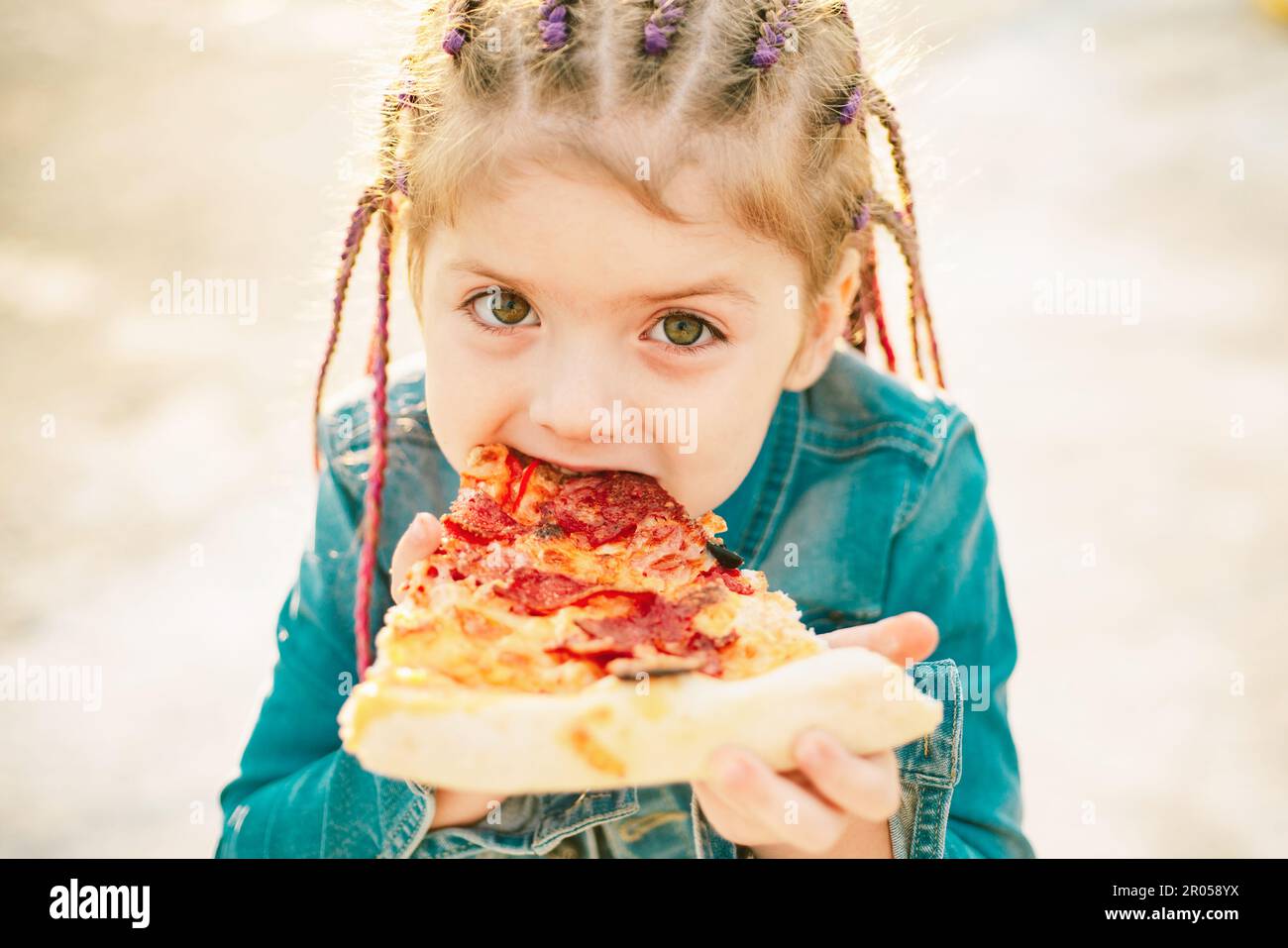 Kid eat pizza. Child eating pizza. Fastfood for kids. Italian junkfood ...