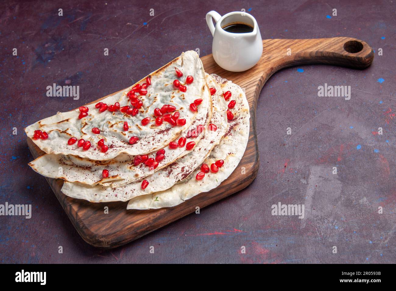 front view tasty meat qutabs pitas with fresh red pomegranates on dark ...