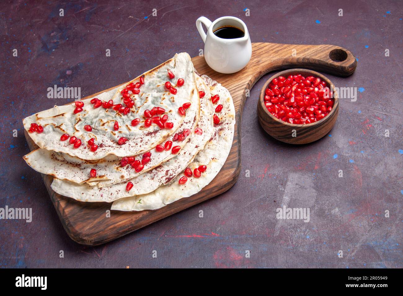 half-top view tasty meat qutabs pitas with fresh red pomegranates on ...