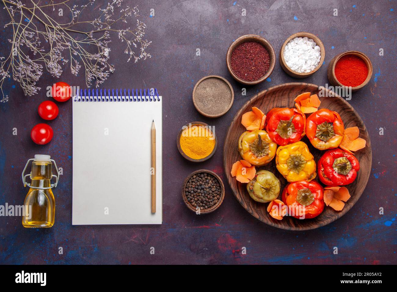 top view cooked bell-peppers with different seasonings on grey ...