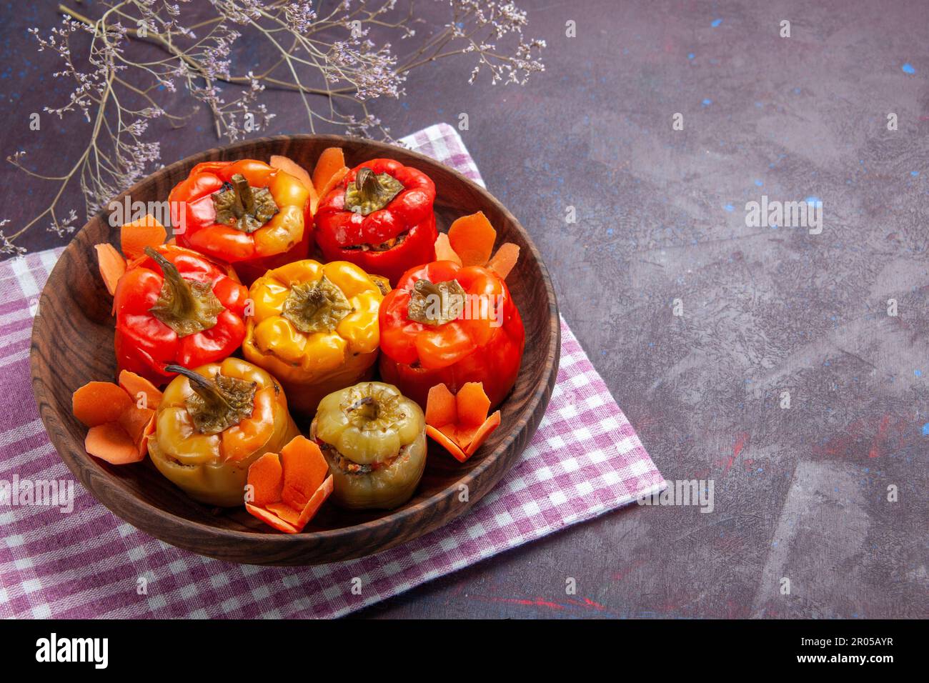 top view cooked bell-peppers with different seasonings on grey desk ...