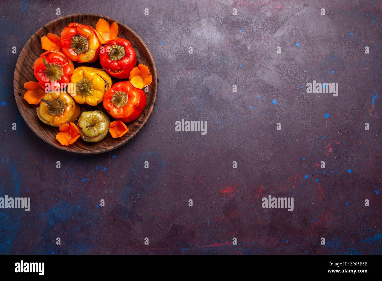 top view cooked bell-peppers with ground meat inside on a grey ...