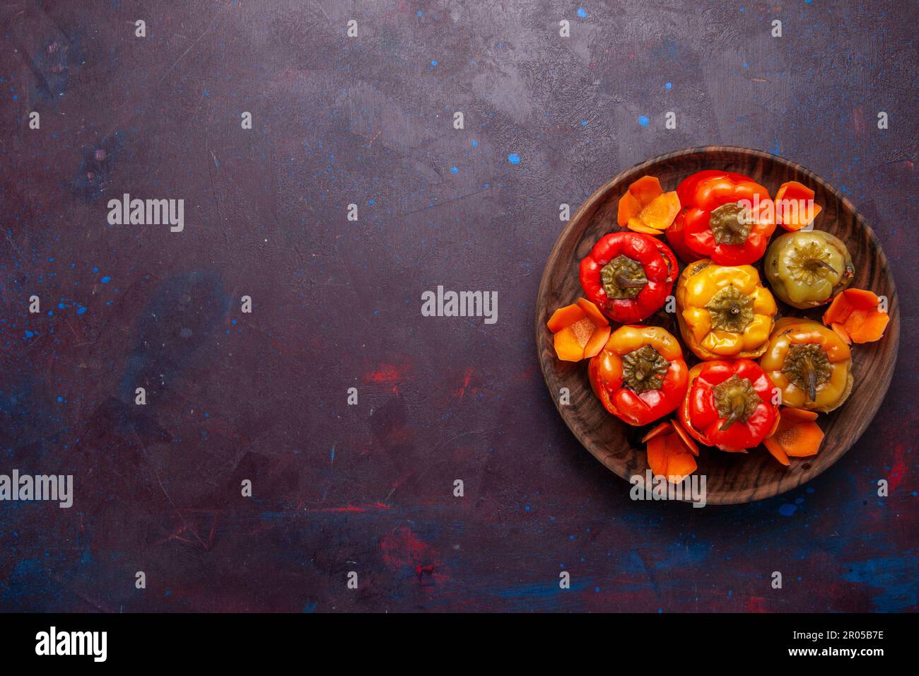 top view cooked bell-peppers with ground meat inside on grey background ...