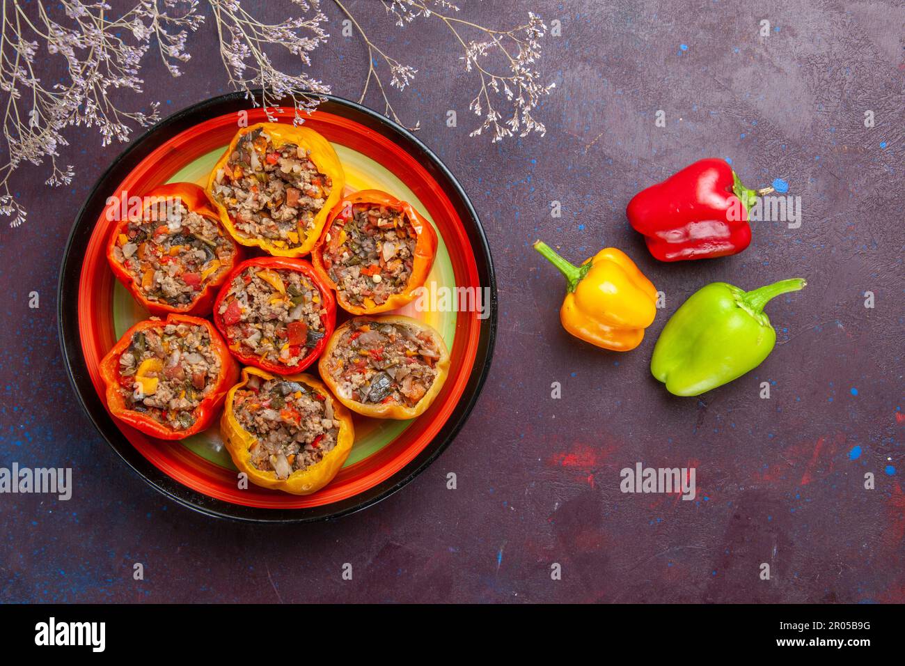 top view cooked bell-peppers with ground meat on a grey background meal ...