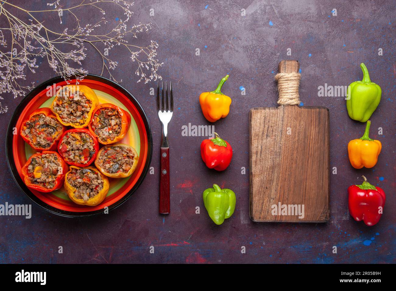 top view cooked bell-peppers with ground meat on a grey background ...