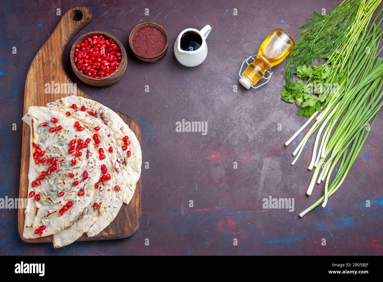 top view delicious meat qutabs pitas with fresh red pomegranates on a ...