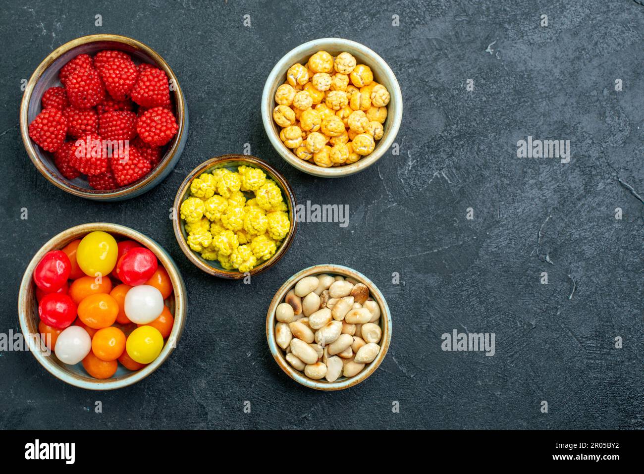 top view different sweet candies inside pots on dark background candy ...