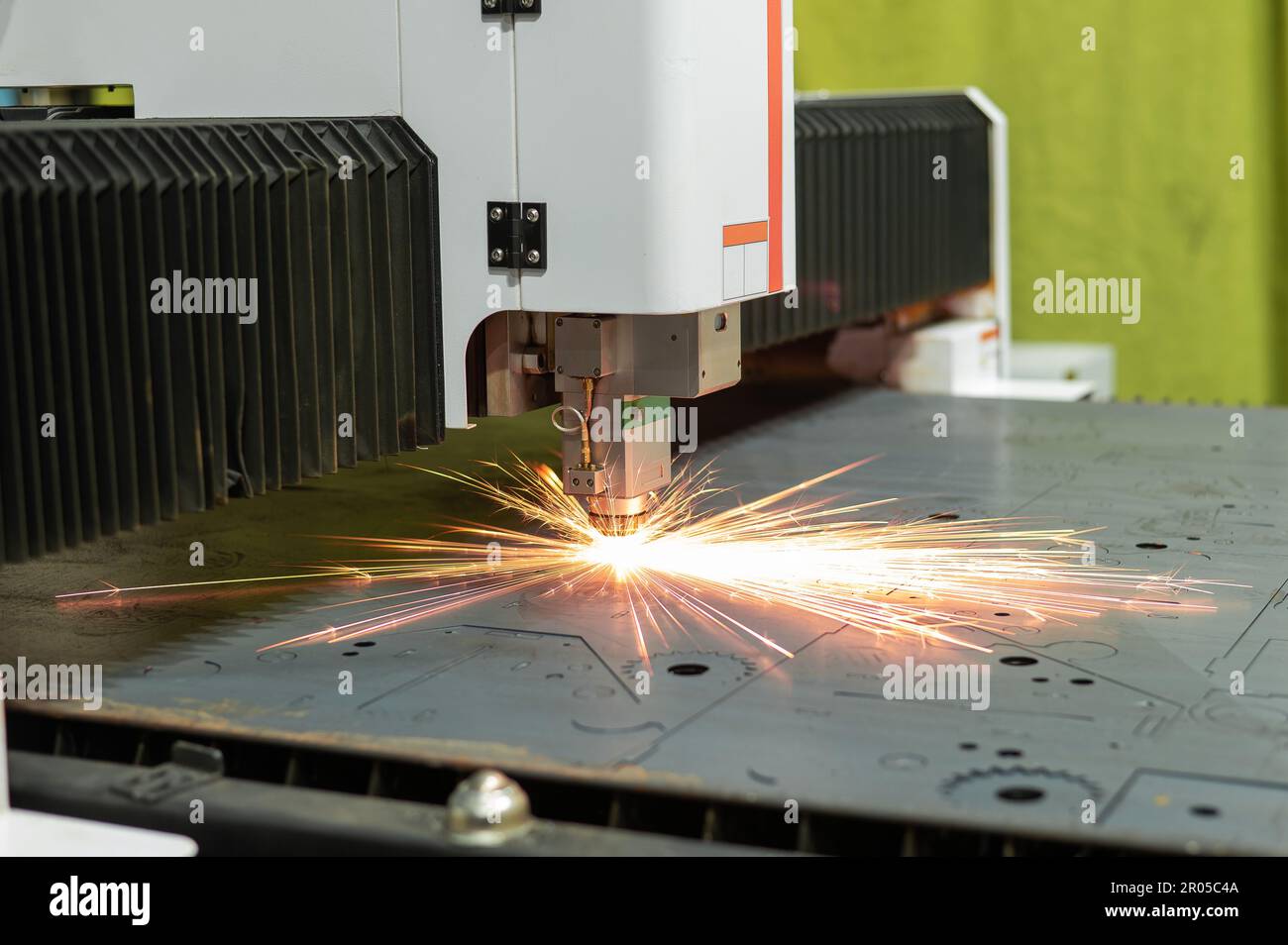 CNC machine. Laser cutting of metal. Sparks Stock Photo - Alamy