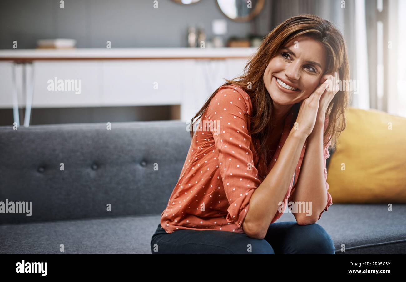 Make yourself comfortable, youre home now. an attractive young woman ...